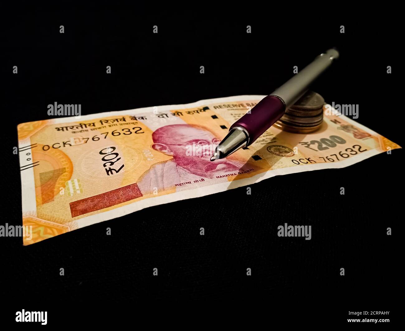 Indian currency two hundred 200 rupees note isolated on black ...