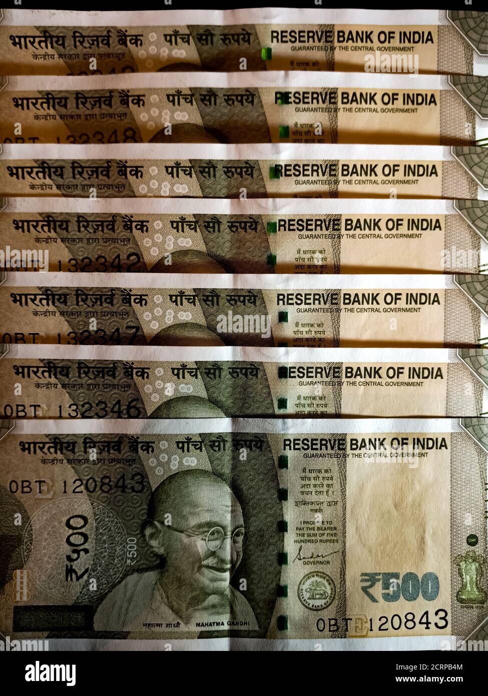 Indian currency set of five hundred 500 rupees note isolated on black ...