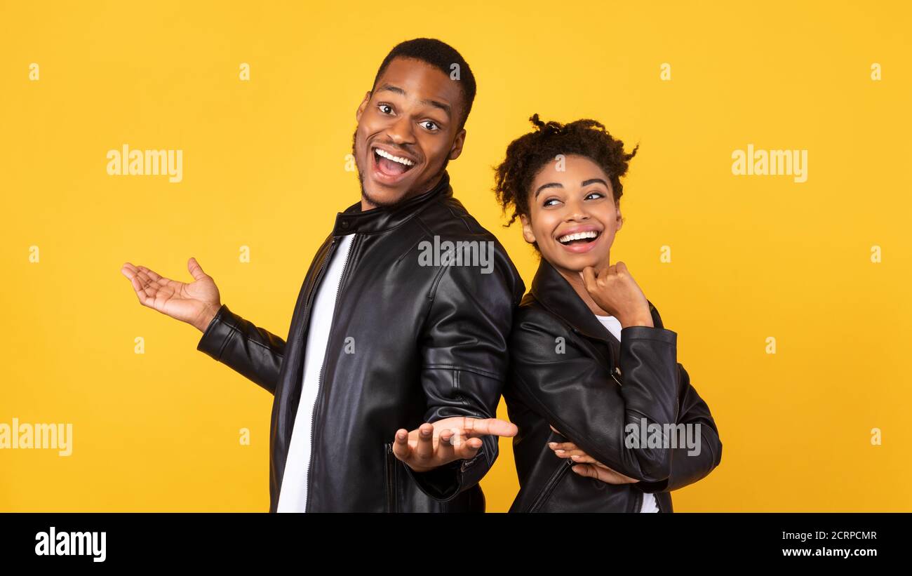 Cheerful African Boyfriend And Girlfriend Standing Back-To-Back Over ...