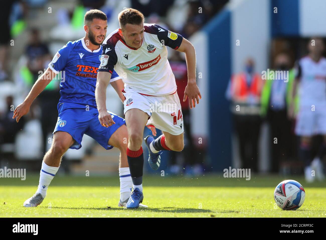 Tom White of Bolton Wanderers and Luke Gambin of Colchester United ...
