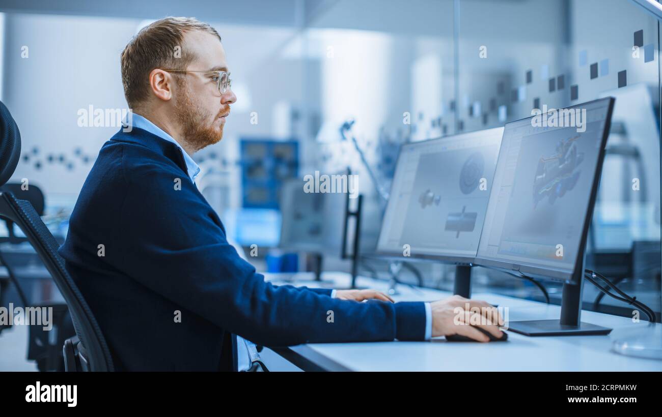 Shot of a Heavy Industry Engineer Working on Personal Computer, Screen ...