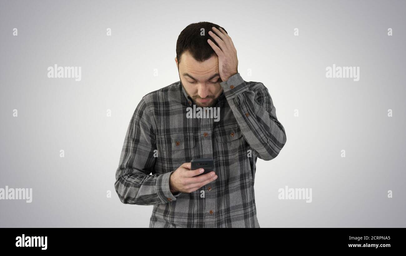 Stressed young man shocked surprised, horrified and disturbed, b Stock ...