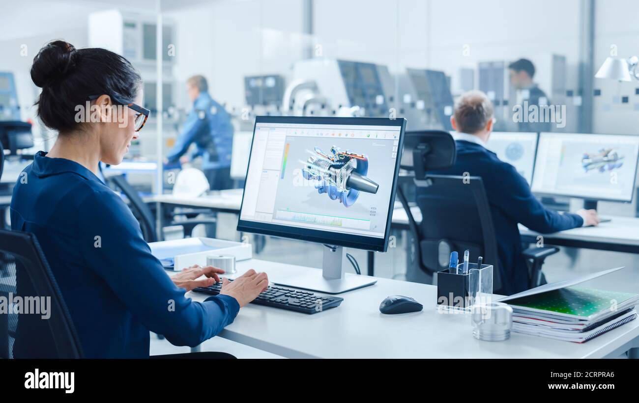 Industrial female Engineer Working on a Personal Computer, Screen Shows ...