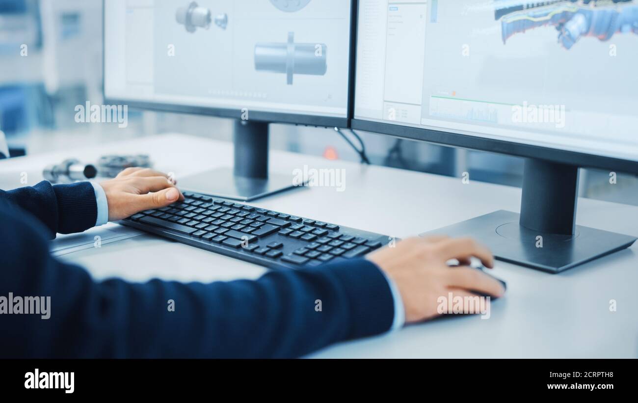 Close-up Shot of Industrial Engineer Working on a Personal Computer ...