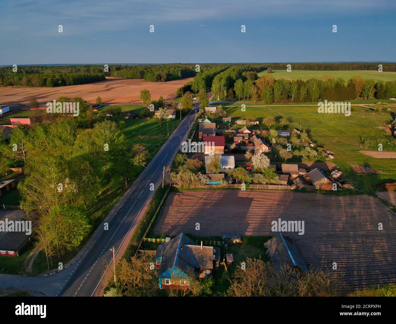 Panoramic shot of a landscape with a country road in the Minsk Region ...