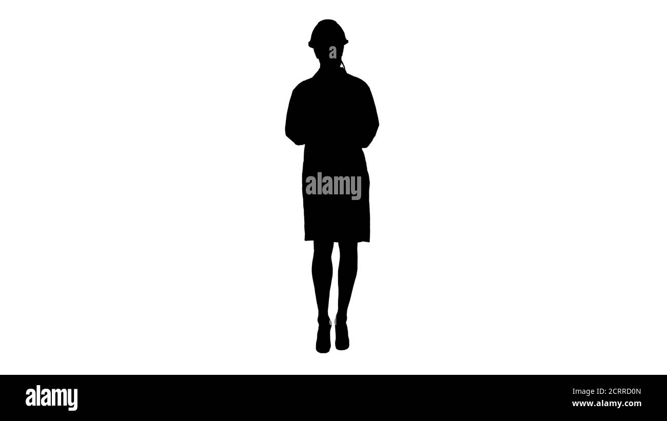 Silhouette Woman engineer writing checklist walking Stock Photo - Alamy