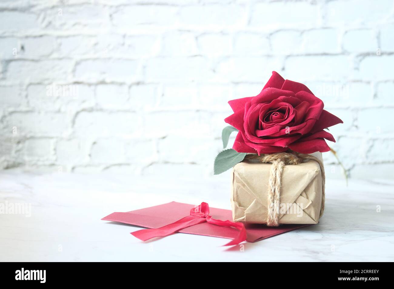 gift box, envelope and rose flower on white background Stock Photo - Alamy