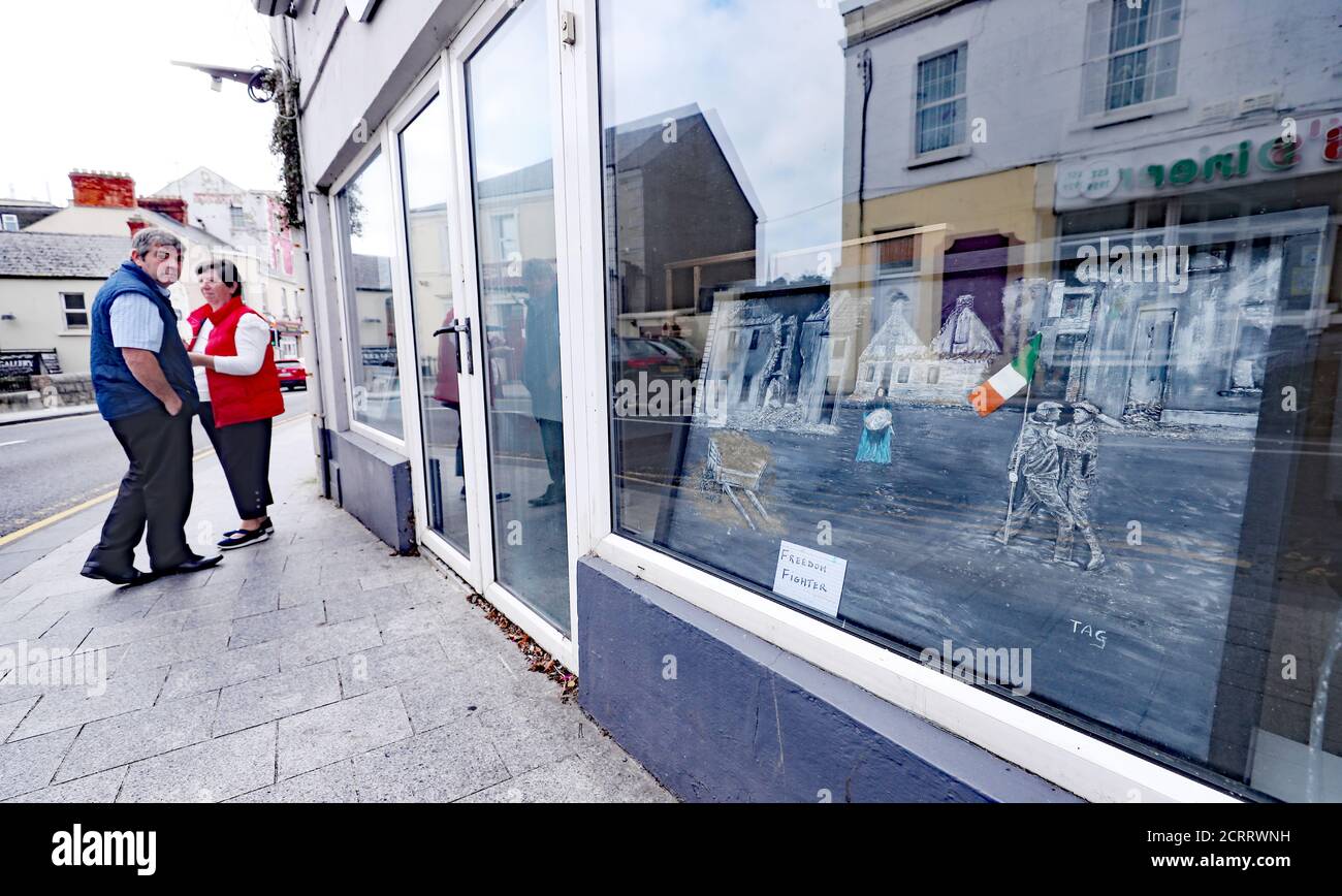 People look at a painting in a shop on Bridge Street in Balbriggan Co ...