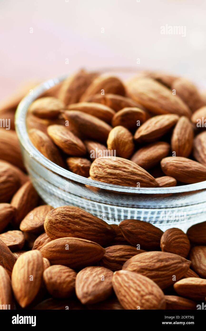 Almonds in bowl, Group of almond nuts isolated on white background ...