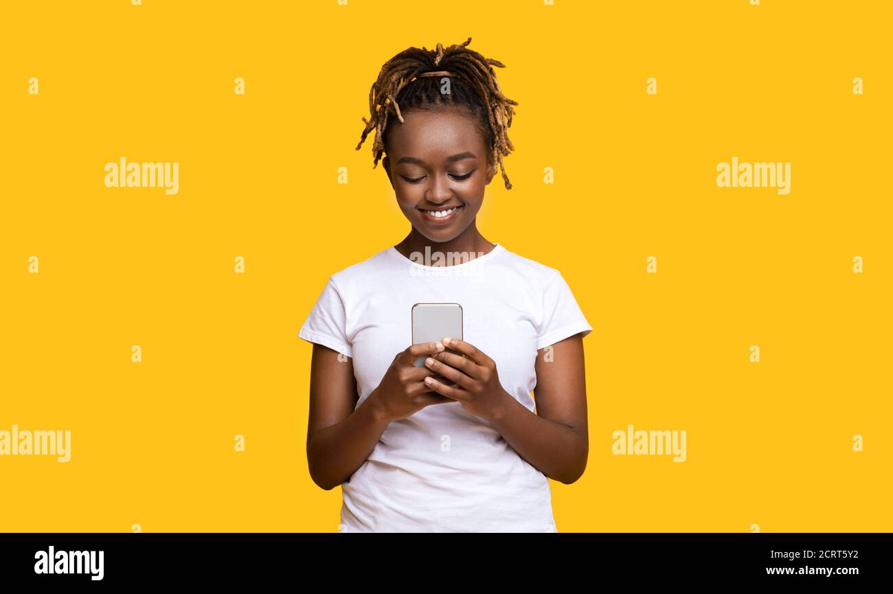 Happy black lady using hi-res stock photography and images - Alamy