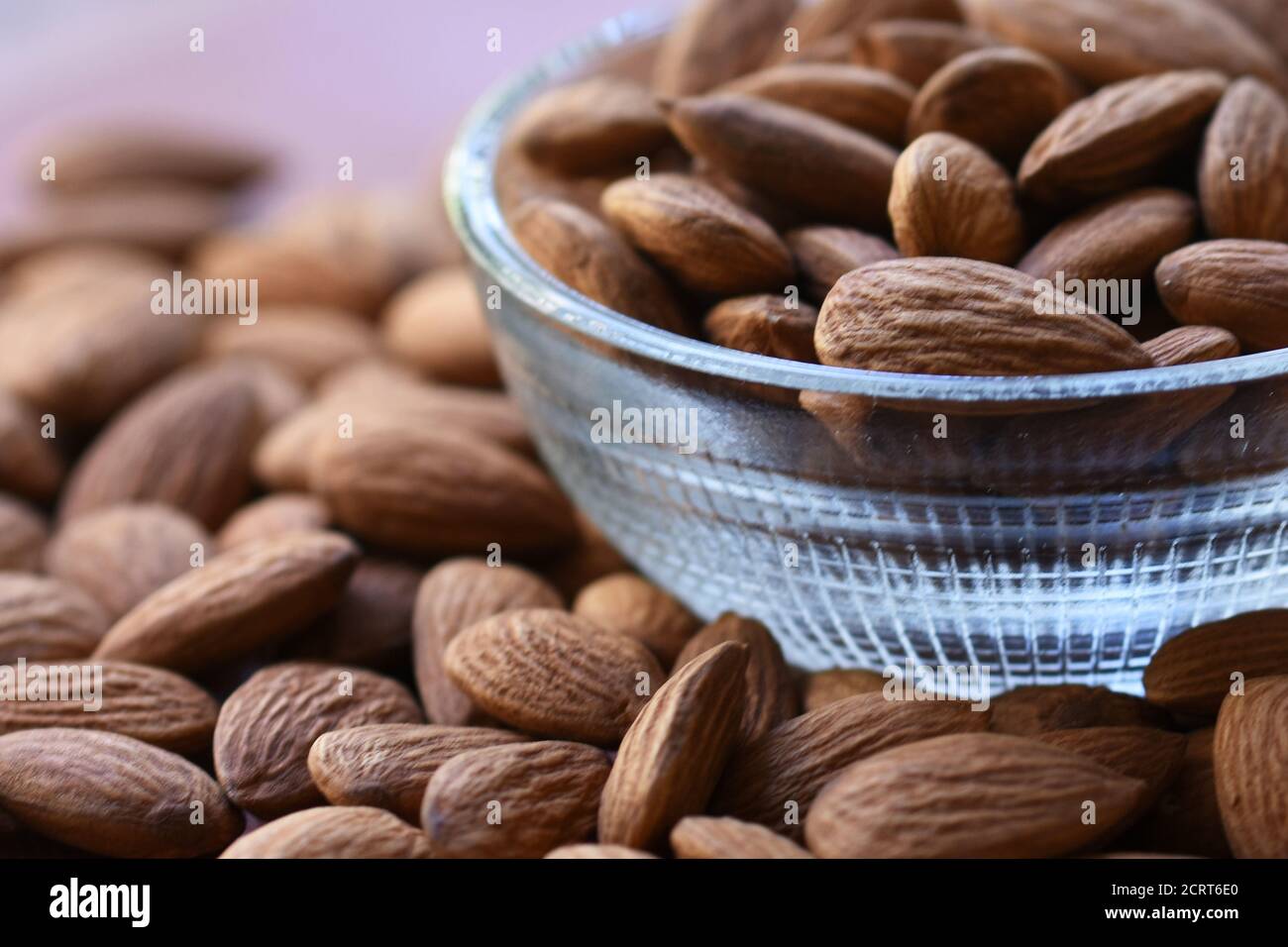 Almonds in bowl, Group of almond nuts isolated on white background ...