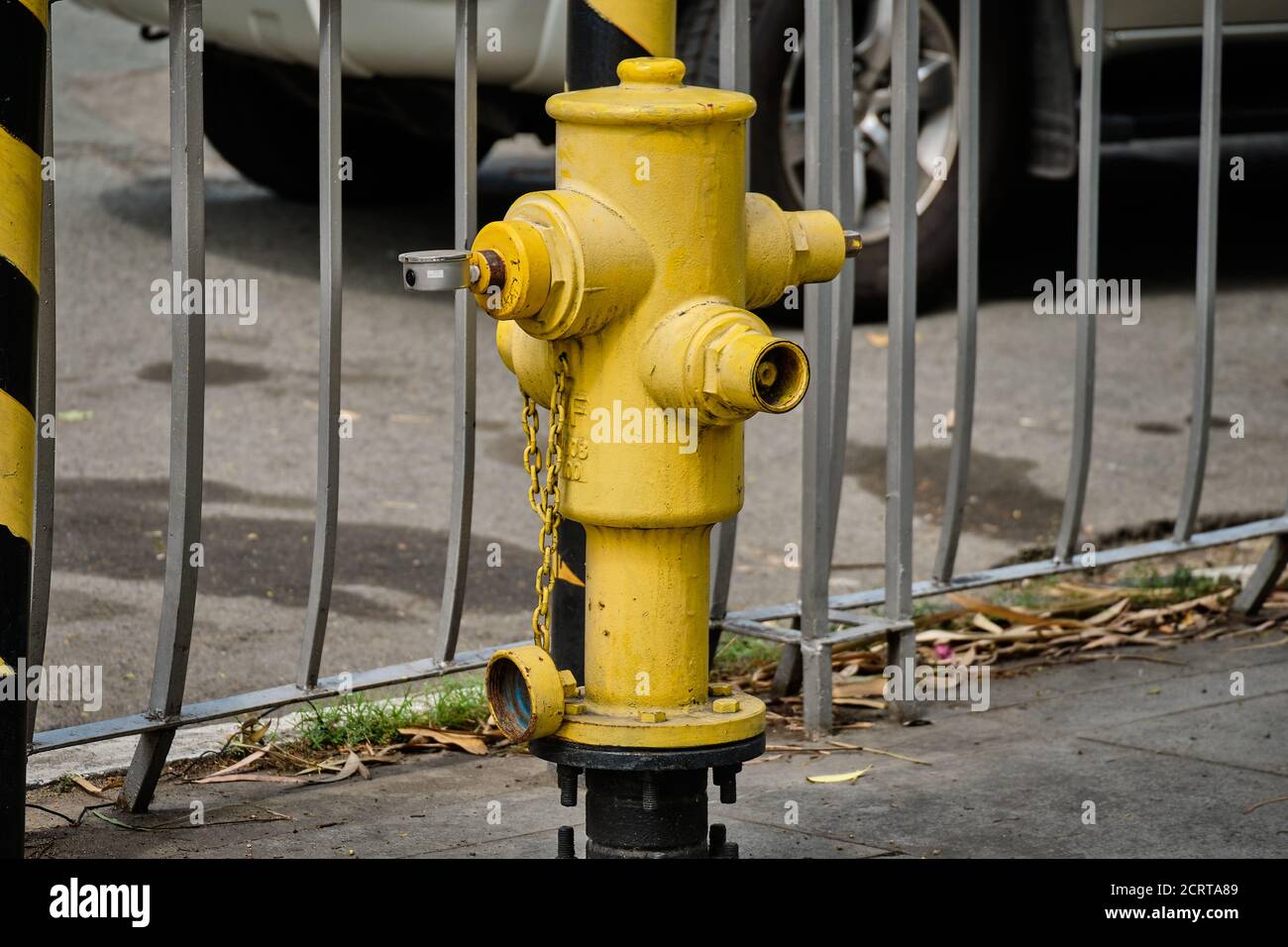 Yellow fire hydrant on a street in Manila Philippines Stock Photo - Alamy