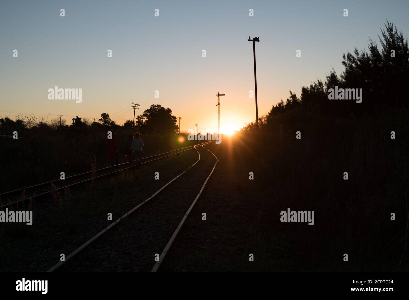 sunset on the train rail Stock Photo - Alamy