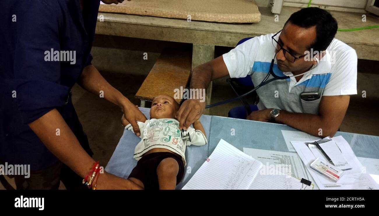 Indian man checking pulse hi-res stock photography and images - Alamy