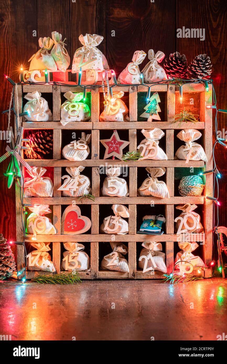 Unique Advent Calendar for Christmas made of bags and stringon dark ...