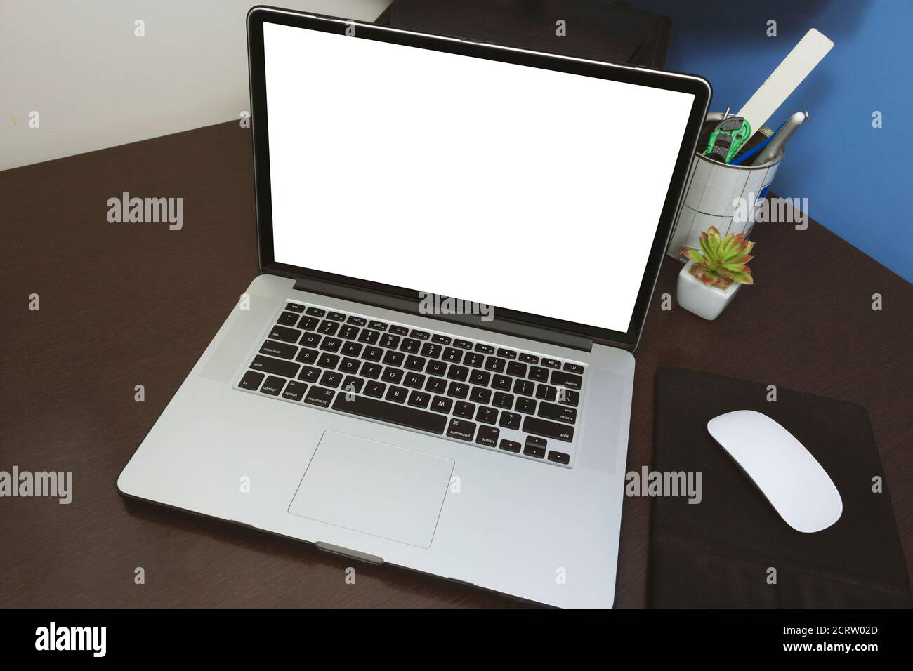 Desk Laptop blank text space screen in office on wood table. Laptop ...