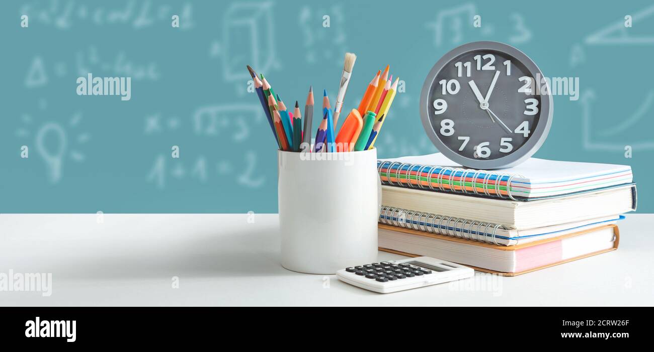 Back to school, student stuff on desk, board in backround Stock Photo ...