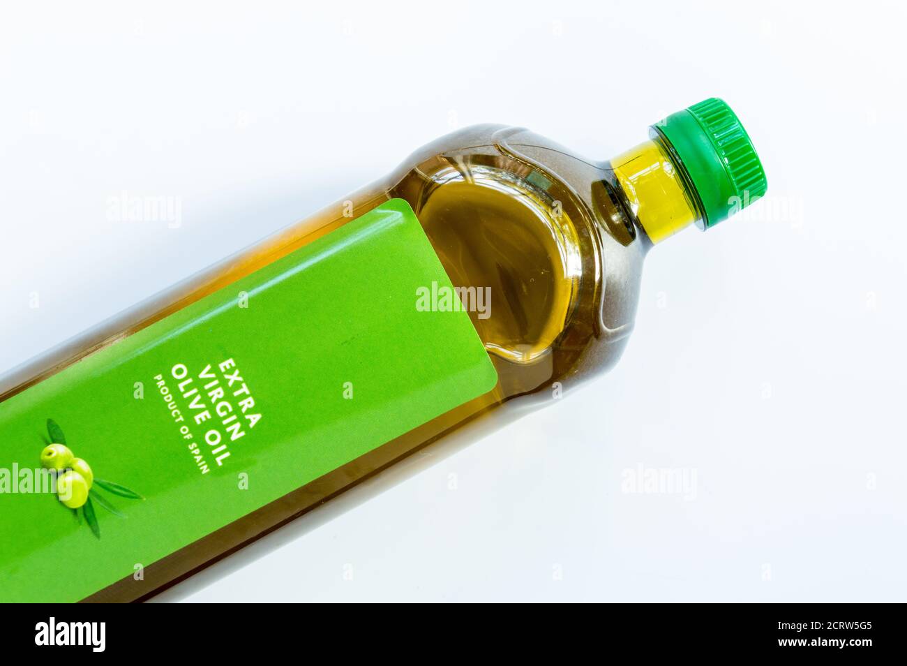 Extra virgin Olive oil in a plastic bottle with sealed cap on white ...