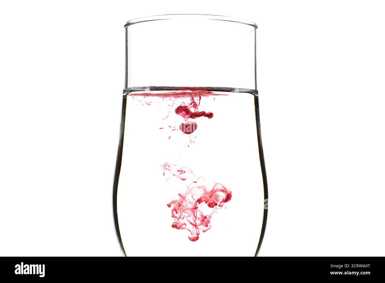 Food coloring diffuse in water inside wine glass area for slogan or ...