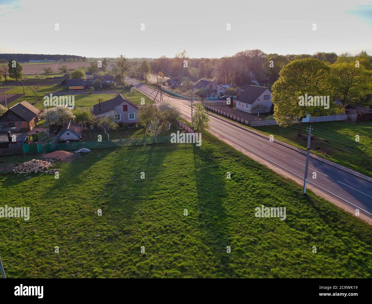 View of a road in the field in Minsk Region of Belarus Stock Photo - Alamy