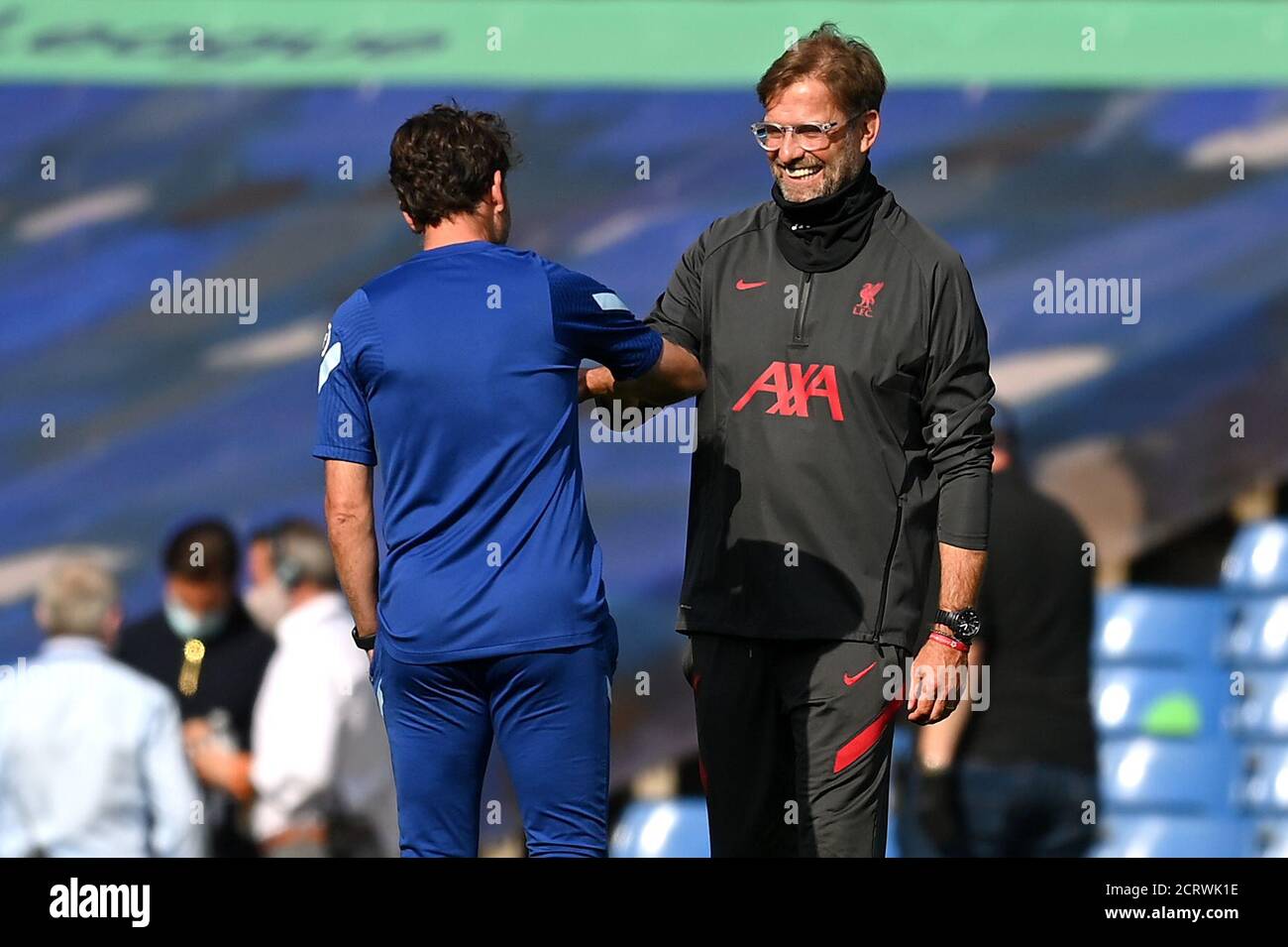 Liverpool manager Jurgen Klopp (right) speaks with Chelsea assistant ...
