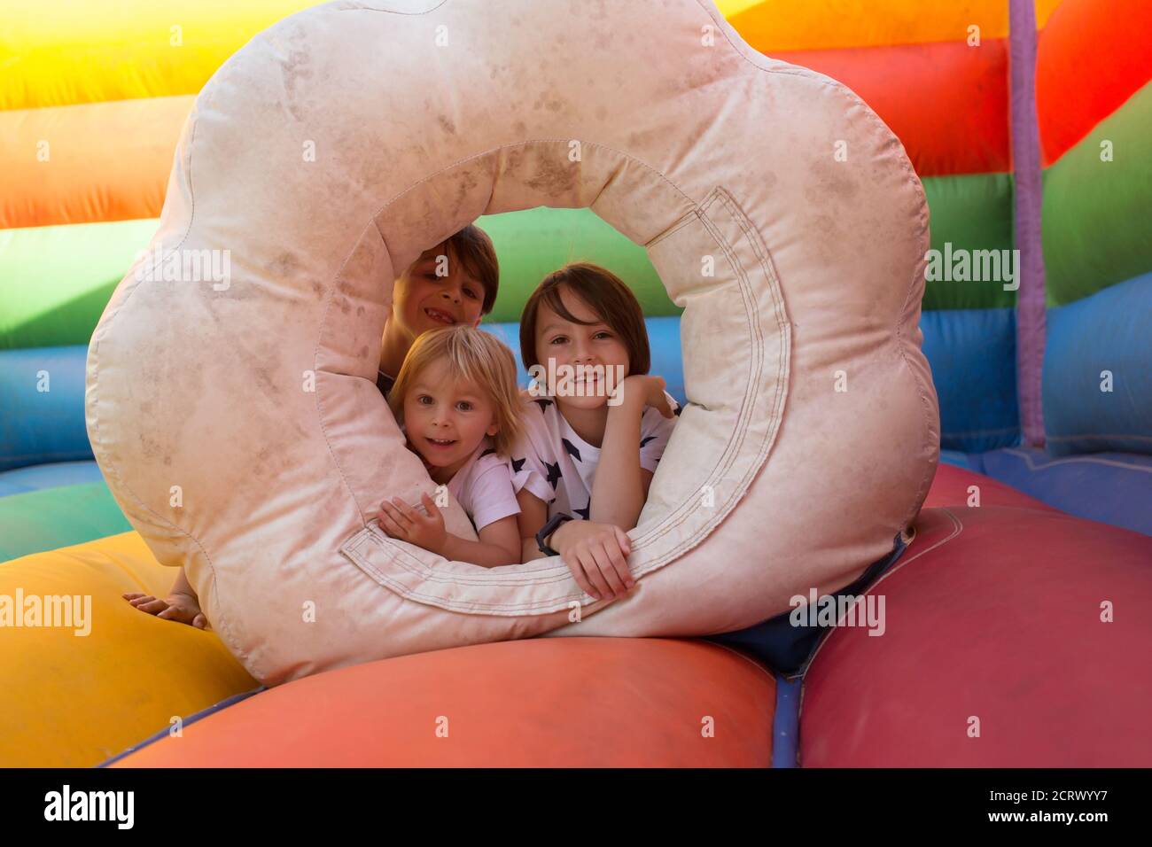 Children, boys, playing jumping on colorful trampoline in park Stock ...