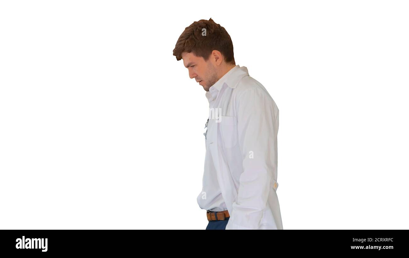 Sad male doctor giving bad news and shaking his head on white ba Stock ...