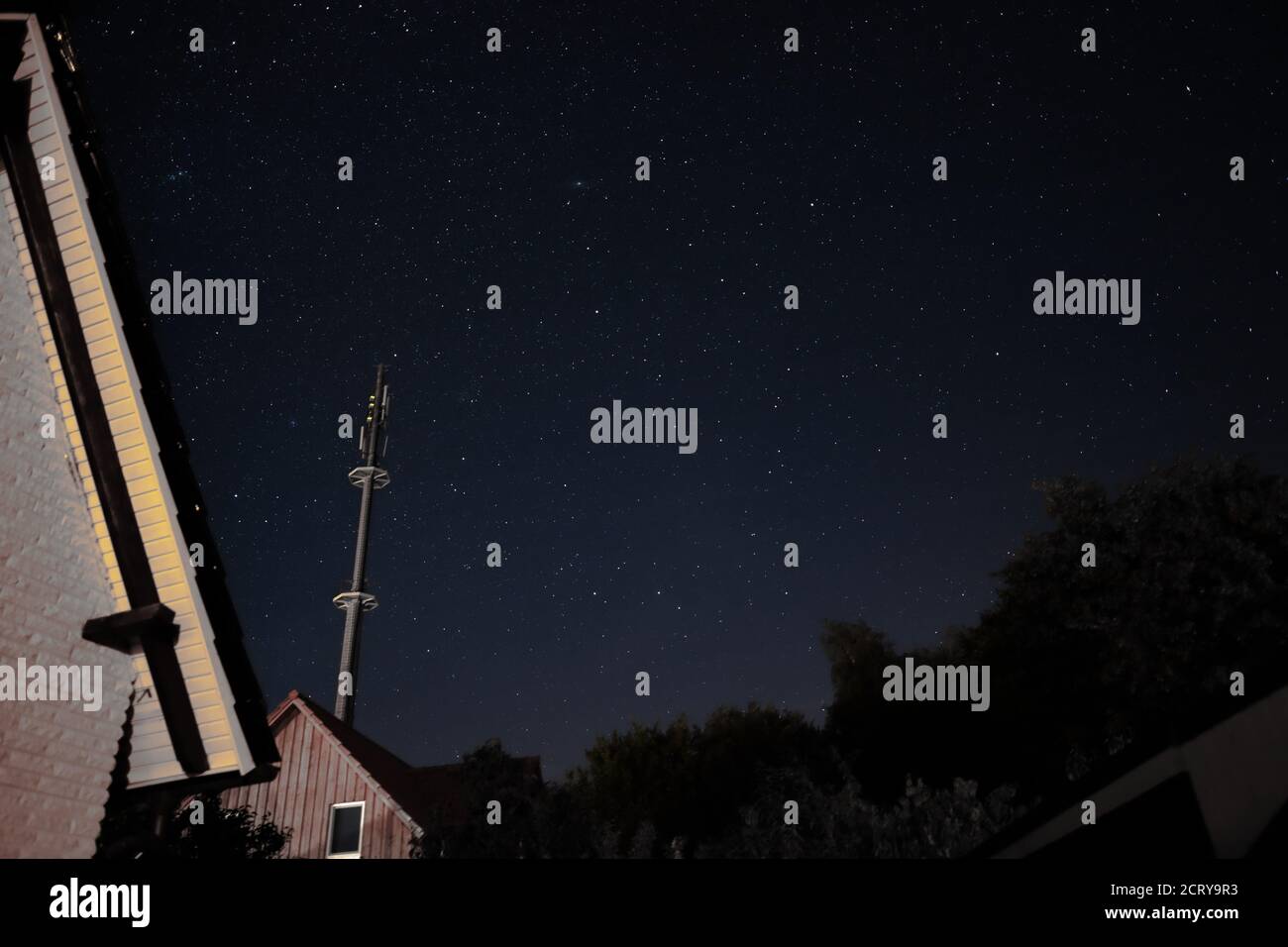 above a residential house many stars shine in the night sky Stock Photo ...