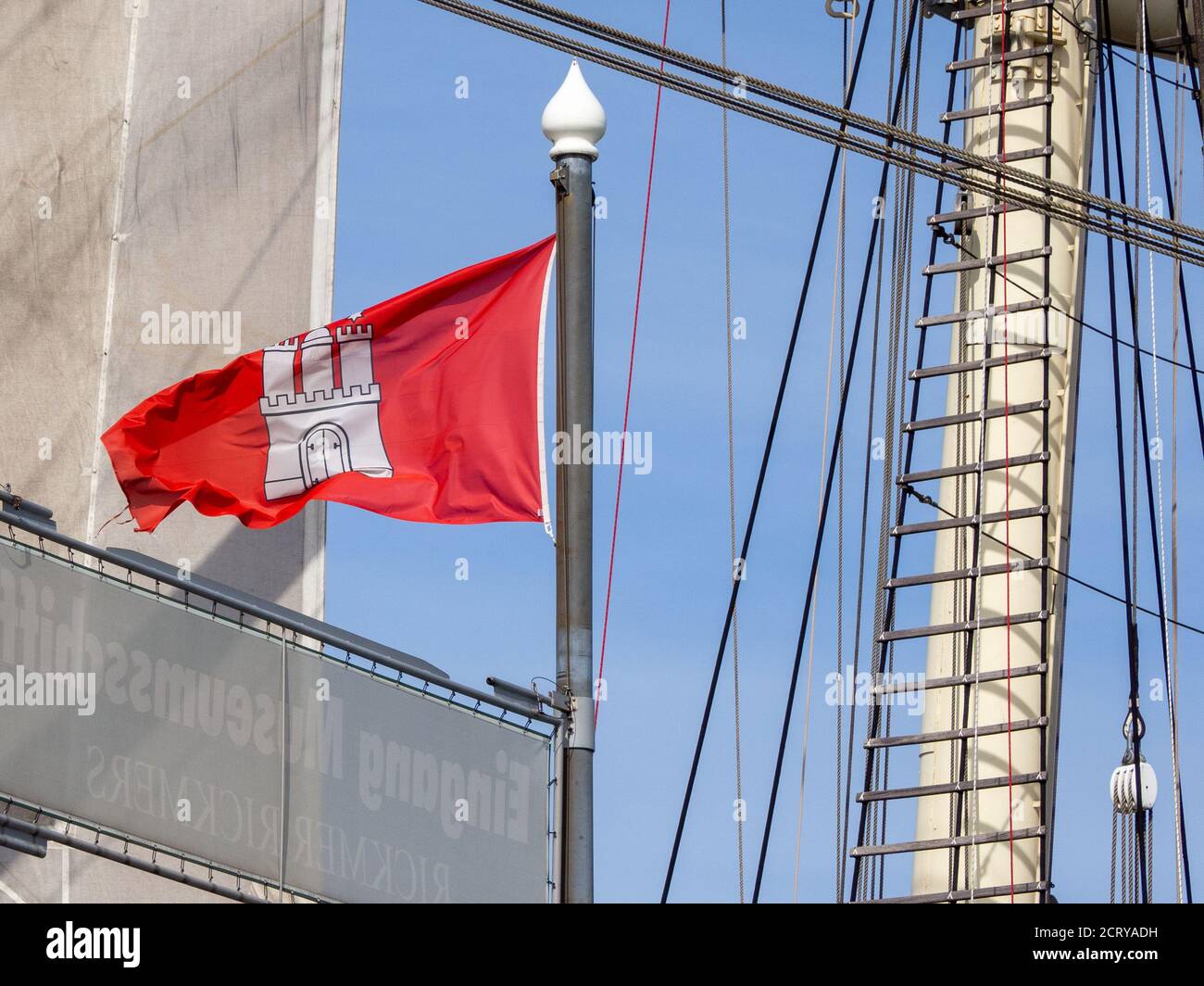 at the end of a flagpole the red flag of Hamburg is waving Stock Photo ...
