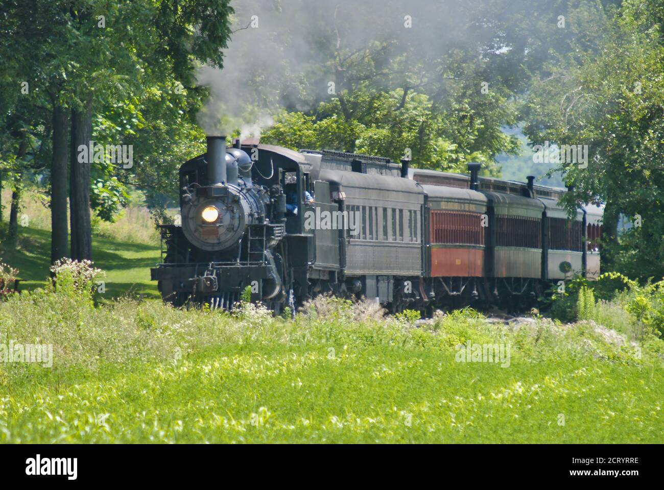 Shot of train with smoke at daytime Stock Photo - Alamy