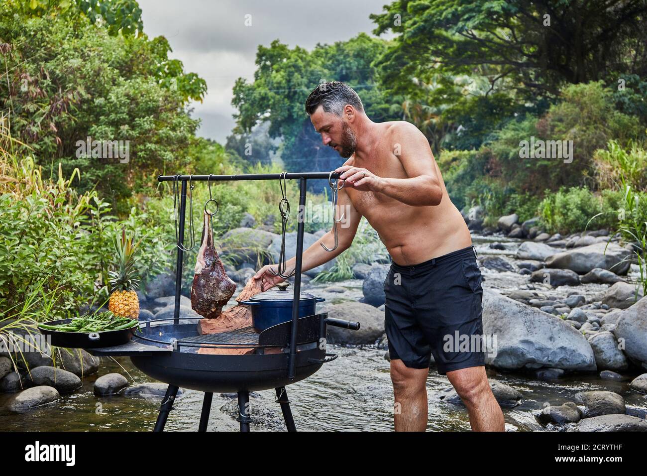 Chef Preparing Barbecue at Campsite Kitchen near Stream Stock Photo - Alamy