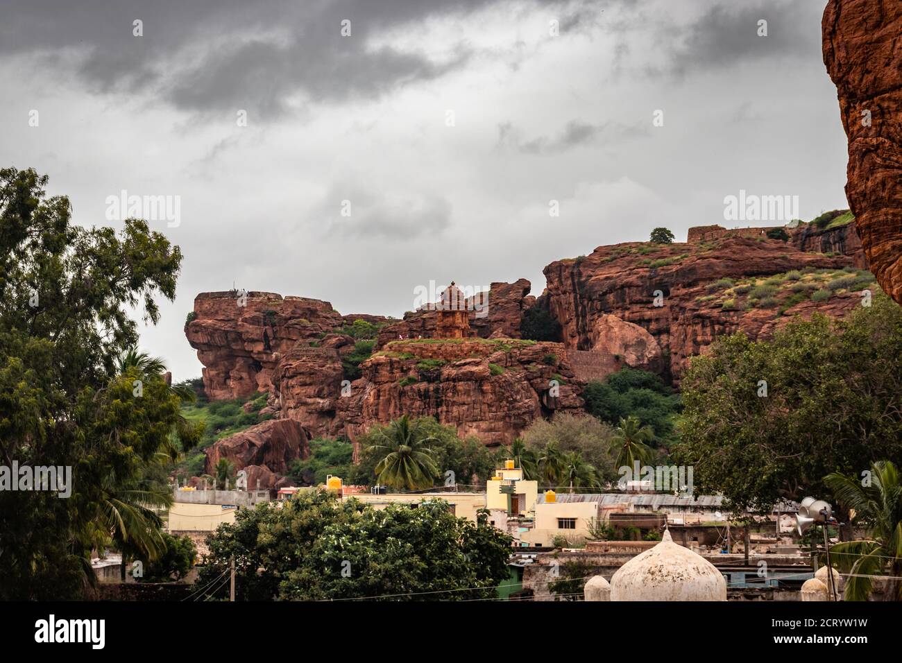 badami rock cut cave with dramatic cloude Stock Photo - Alamy