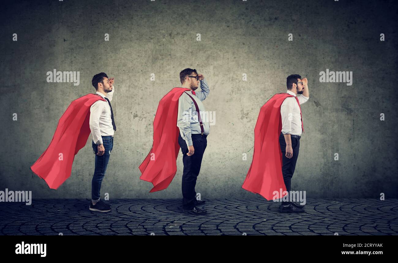 Team of super men looking into the future feeling brave and confident ...