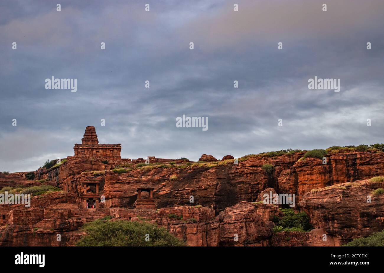mountain top temple with flat sky at morning image is taken at badami ...