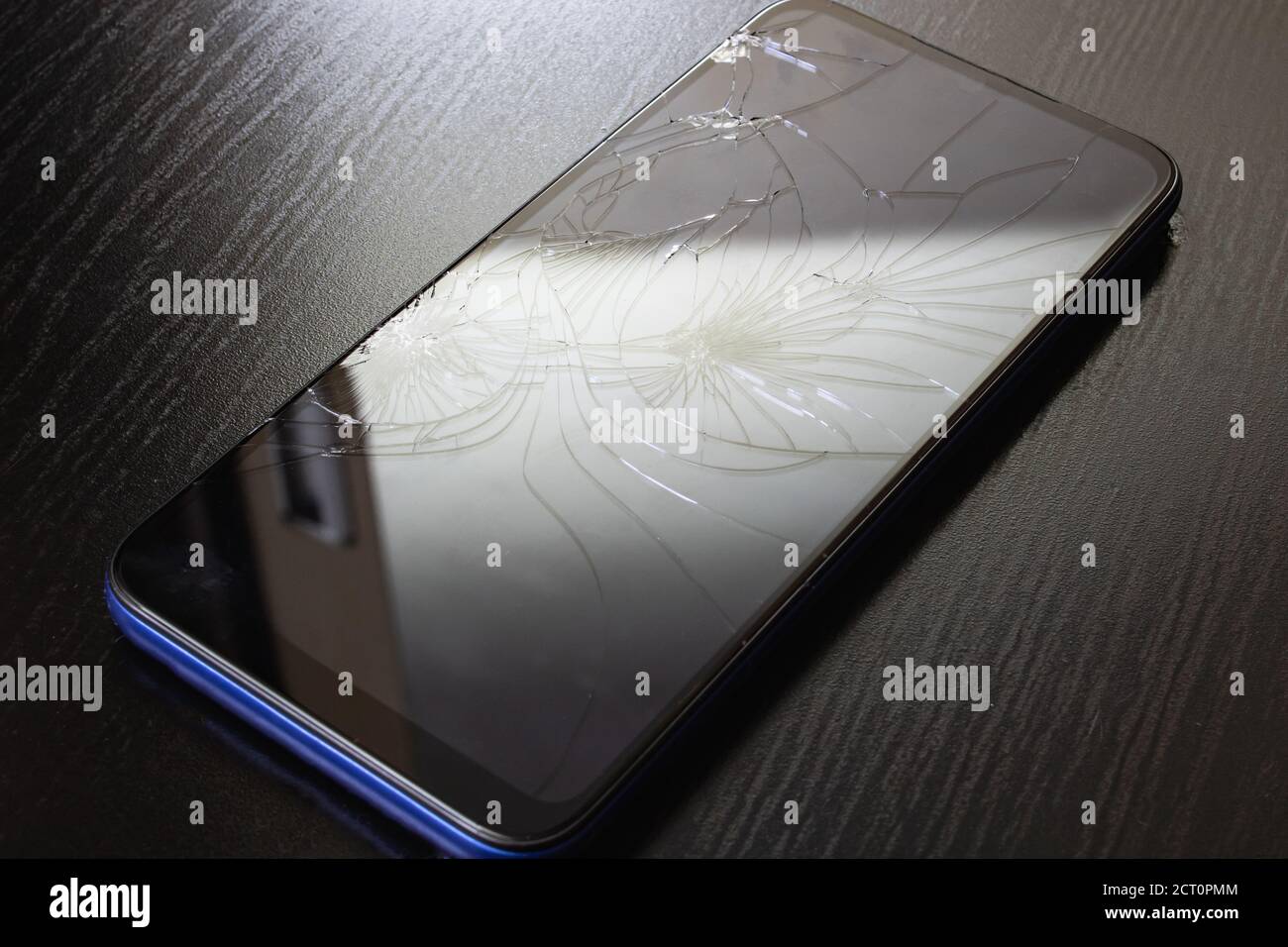 Broken mobile phone display, cracks close up Stock Photo - Alamy