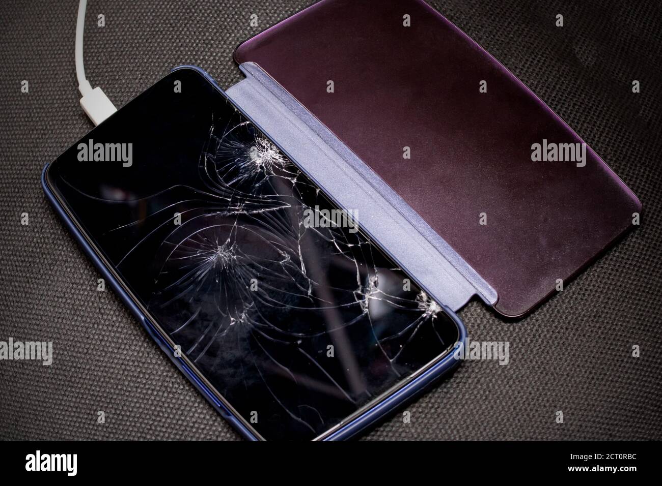 Broken mobile phone display, cracks close up Stock Photo - Alamy