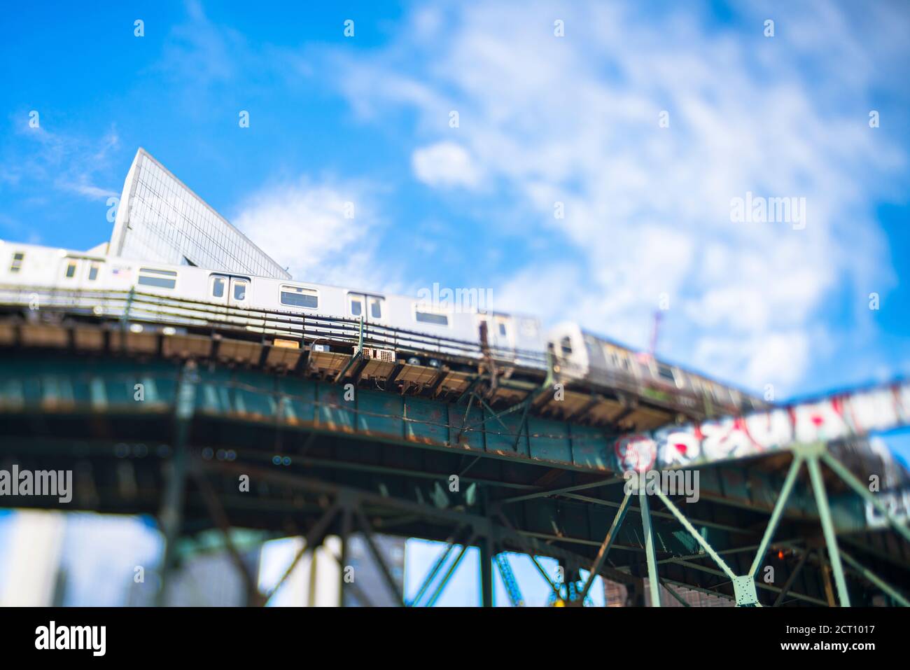 New York City subway runs on the elevated railway track at Queensboro ...