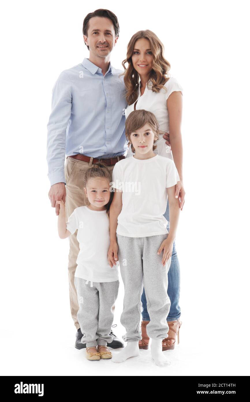 Portrait of happy family of parents and two children studio isolated on ...