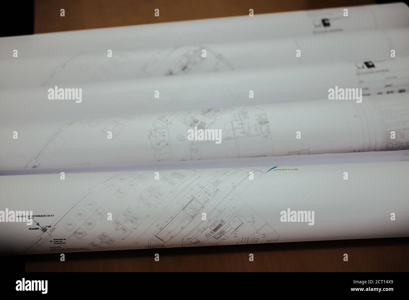 Five rolled papers with blueprint drawings Stock Photo - Alamy