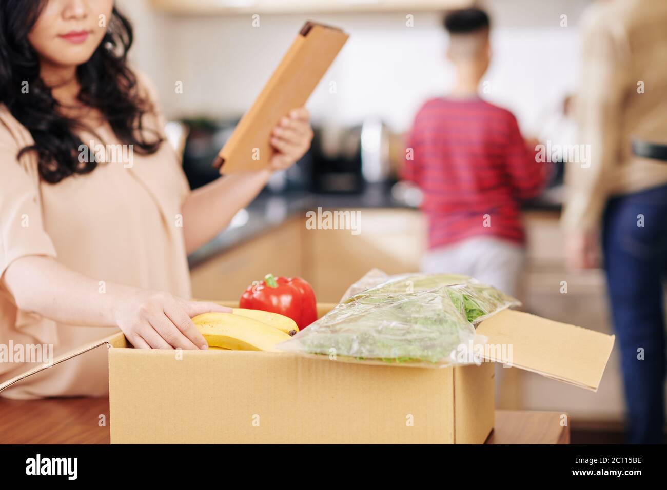 Unpacking grocery delivery Stock Photo - Alamy