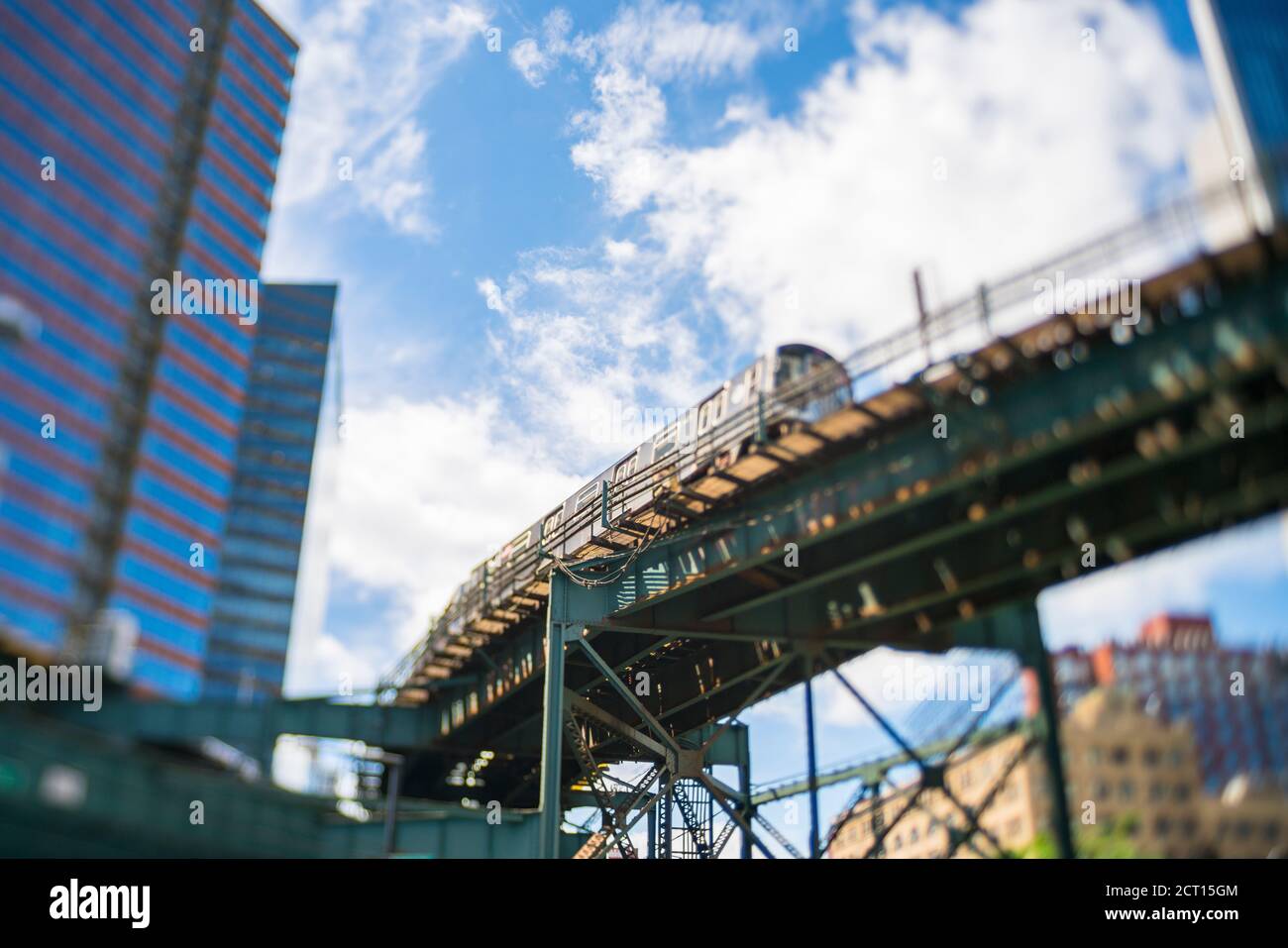 New York City subway runs on the elevated railway track at Queensboro ...
