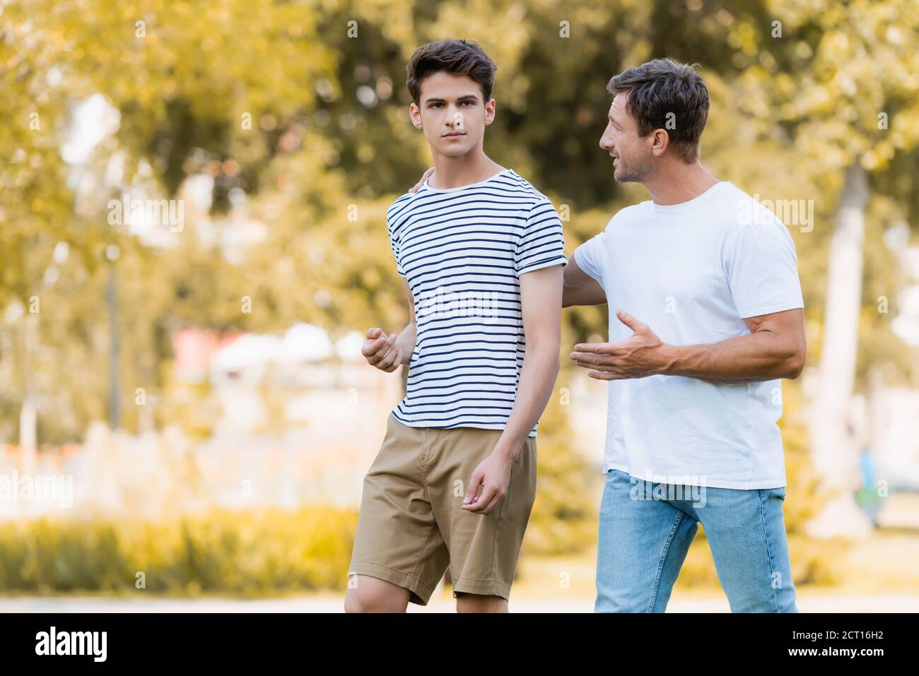 Father And Teenage Son Talking