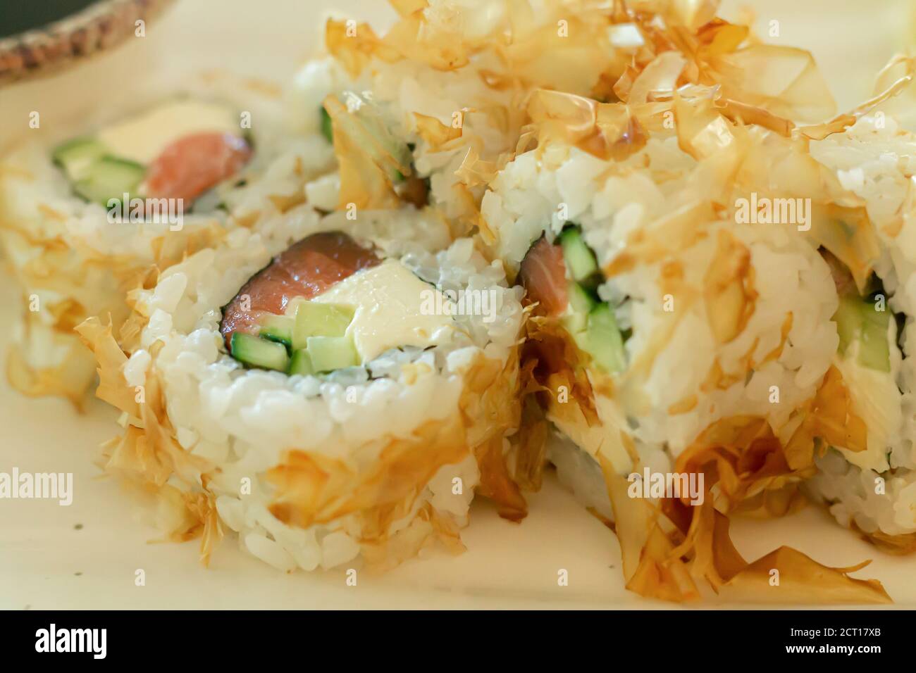 Traditional Japanese food close-up. Set of sushi Bonito rolls with ...