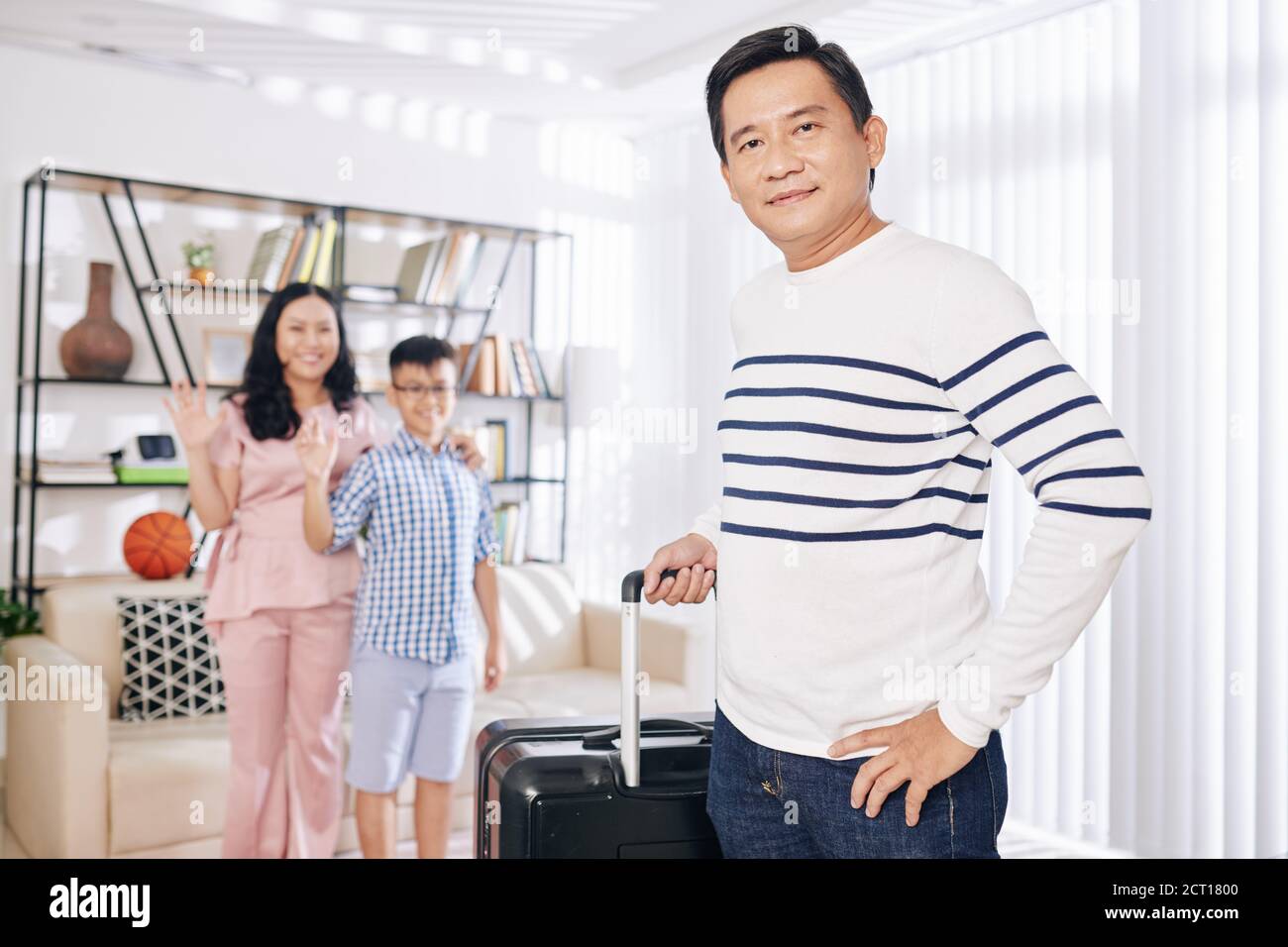 Man leaving for business trip Stock Photo - Alamy