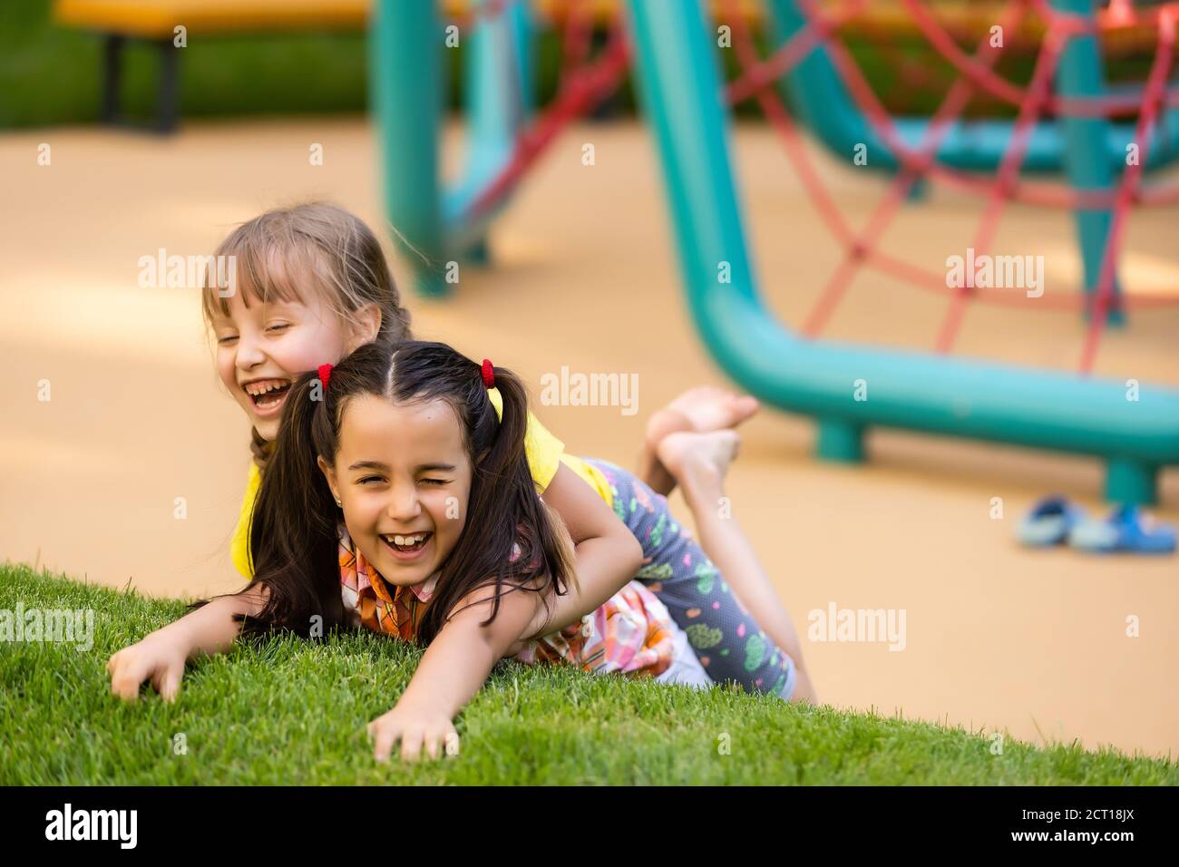 happy excited kids having fun together on playground Stock Photo - Alamy