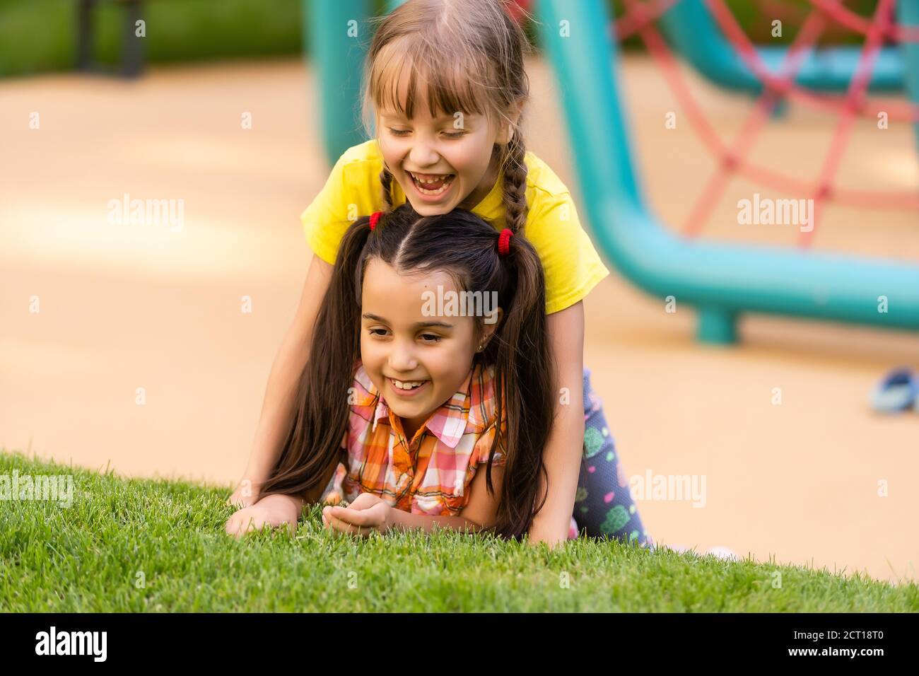 happy excited kids having fun together on playground Stock Photo - Alamy