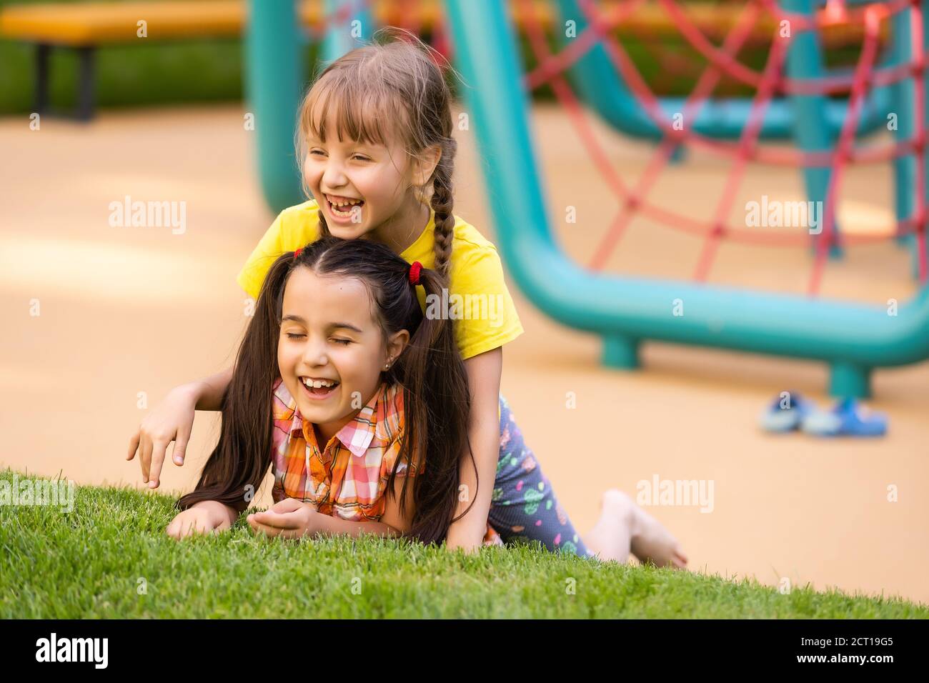 Happy children playing outdoors, children on the playground Stock Photo ...