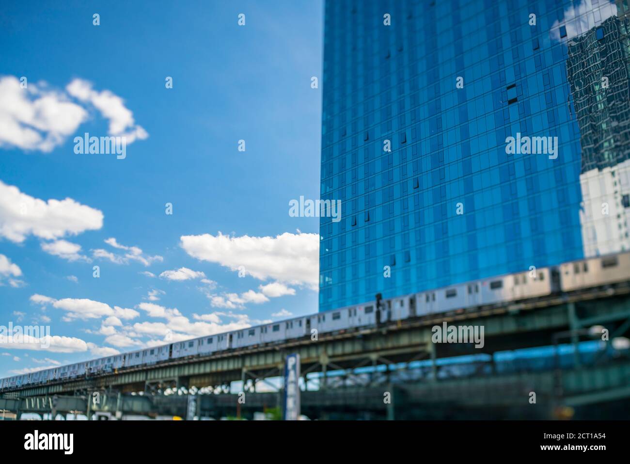 New York City subway runs on the elevated railway track at Queensboro ...