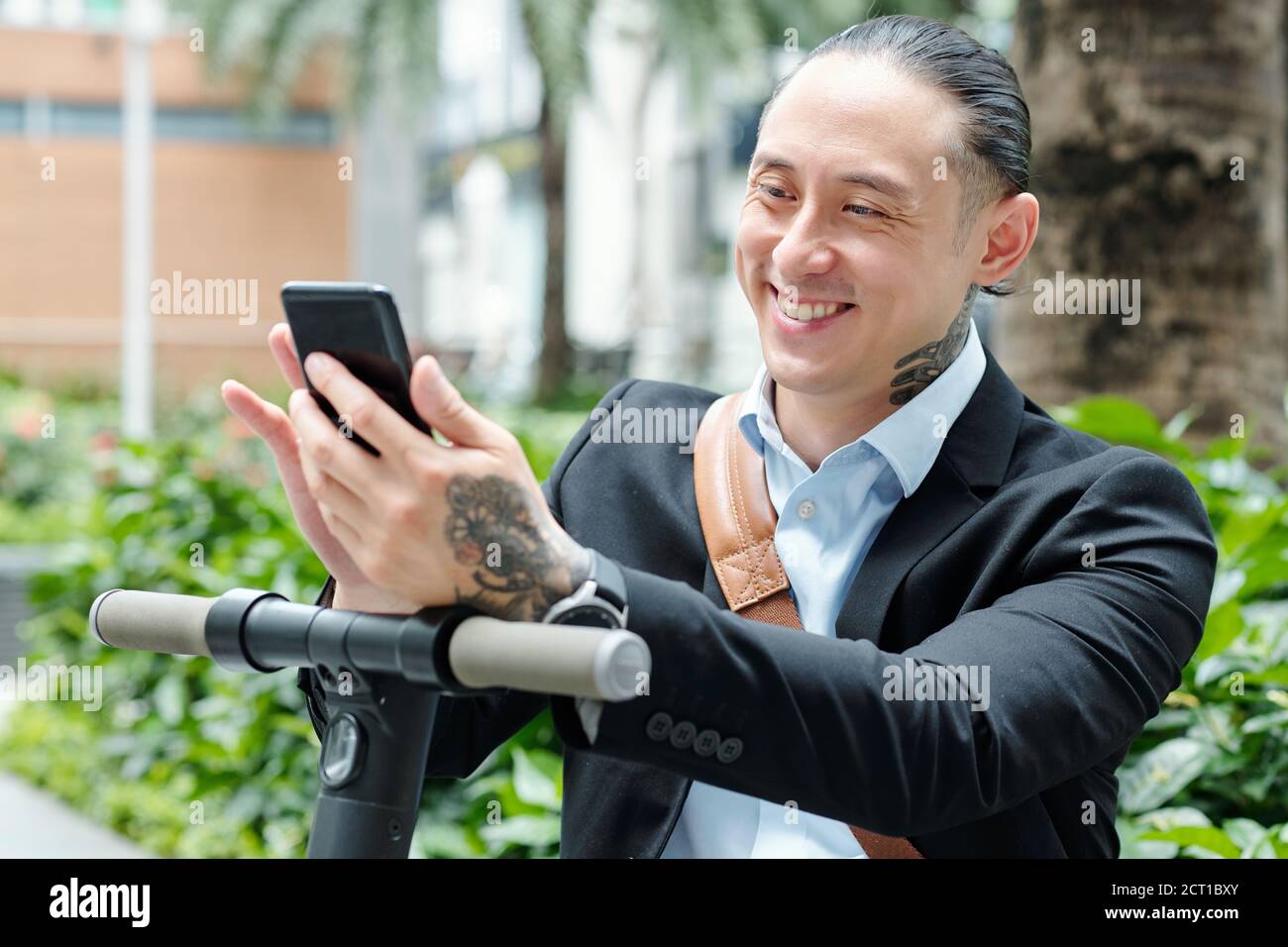 Young man checking text messages hi-res stock photography and images ...