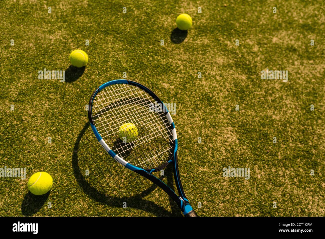 View of empty lawn tennis court with tennis ball Stock Photo - Alamy